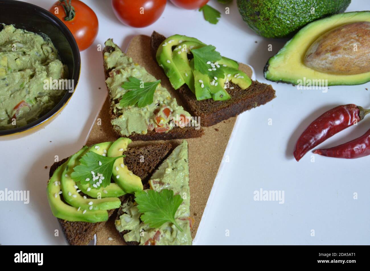 Guacamole and bread. Toast with avocado on white background. Homemade ...