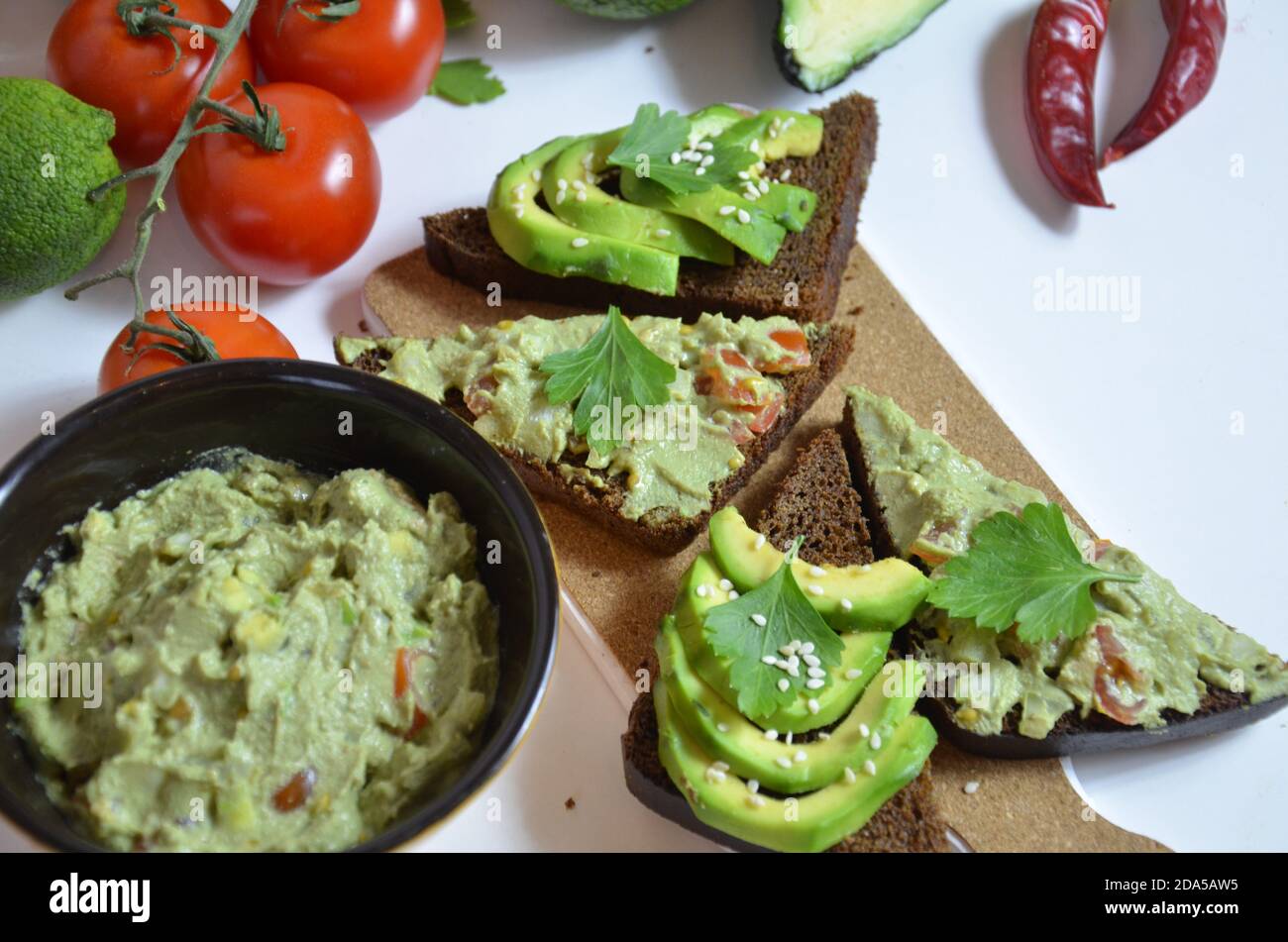 Guacamole and bread. Toast with avocado on white background. Homemade ...