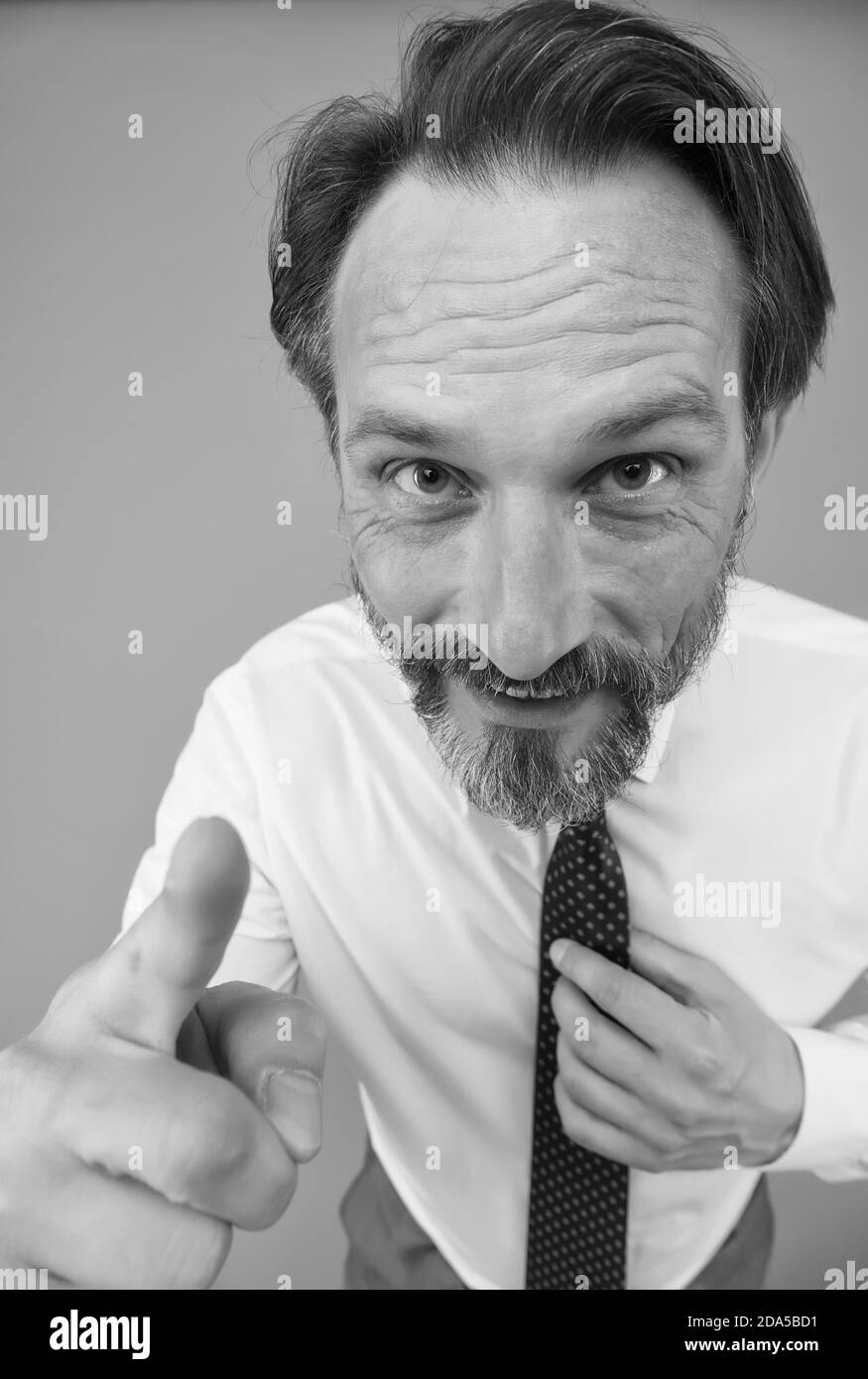 Consider this. Happy salesman pointing index finger. Pointing man with ...