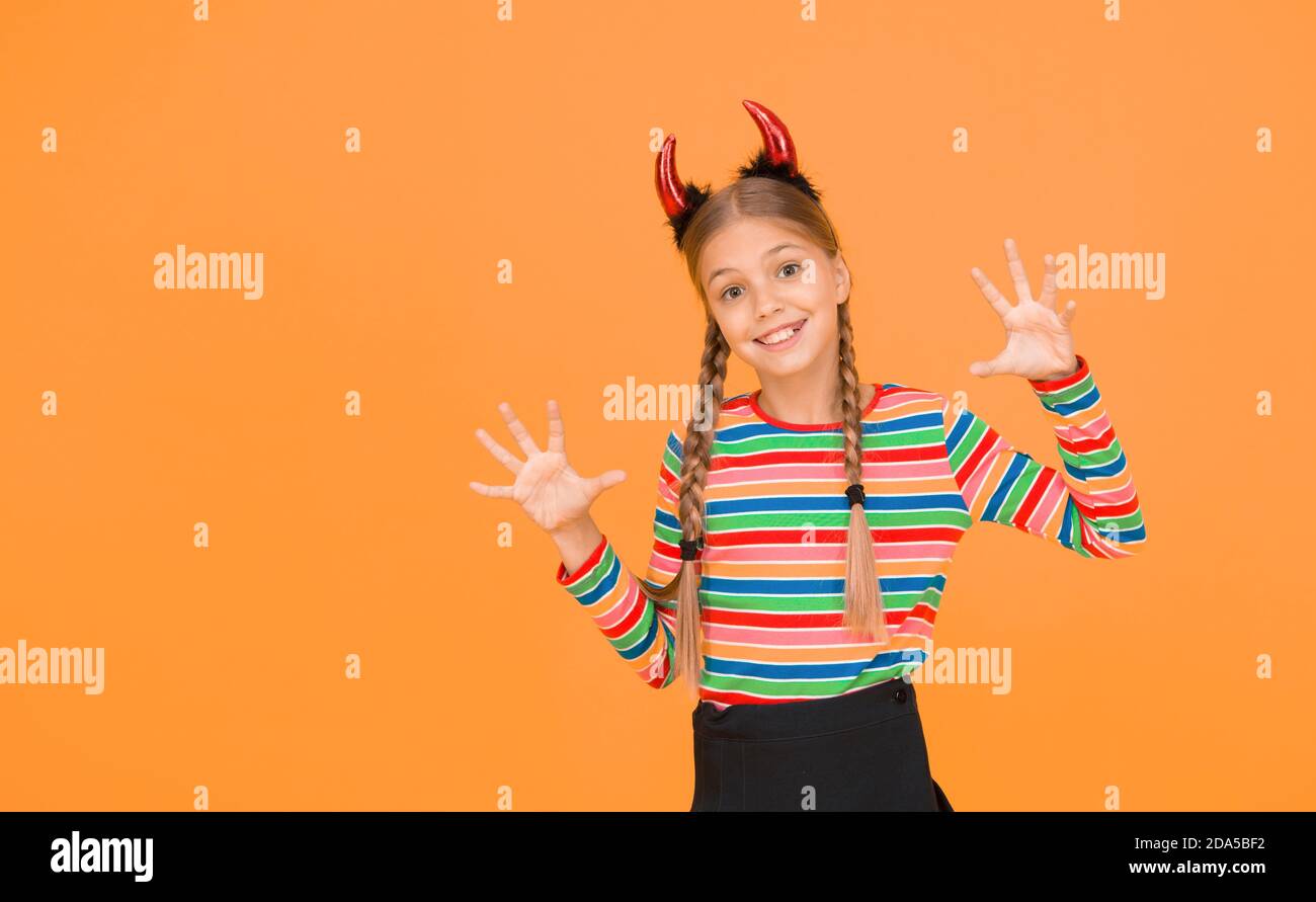She devil. Halloween party girl yellow background. Little girl wear red ...