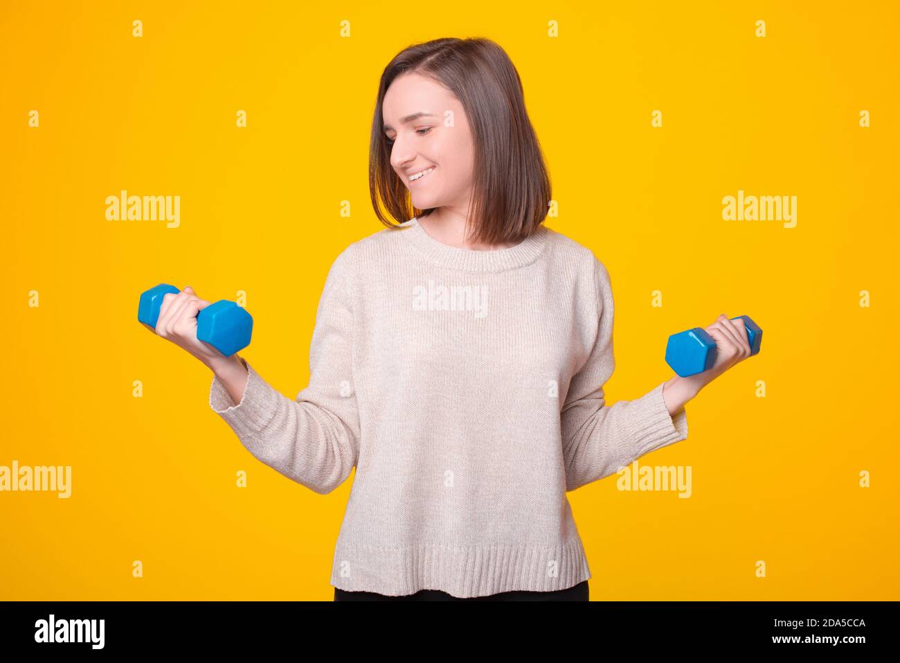 Person lifting dumbells hi-res stock photography and images - Alamy