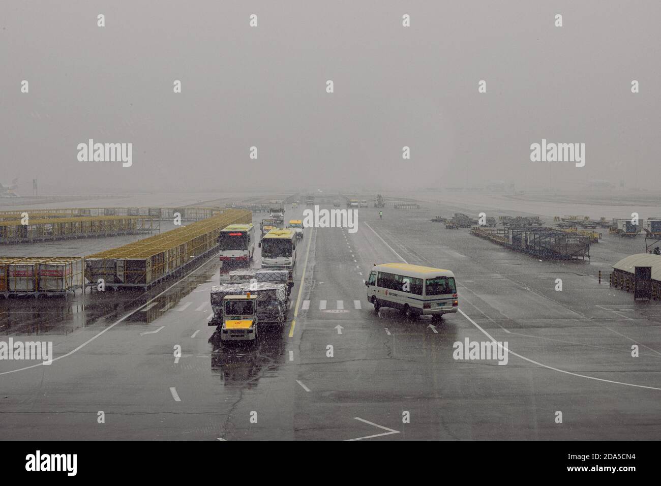 Shuttle buses and baggage buses on the airport tarmac in Geneva ...