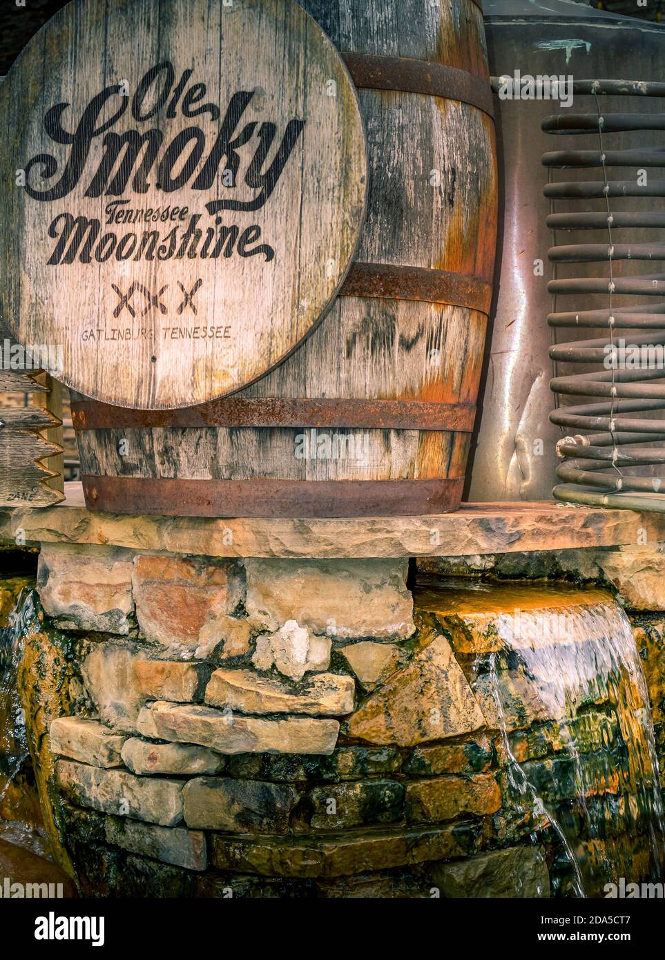 An outdoor oak barrel and advertising displayed over a water fall ...