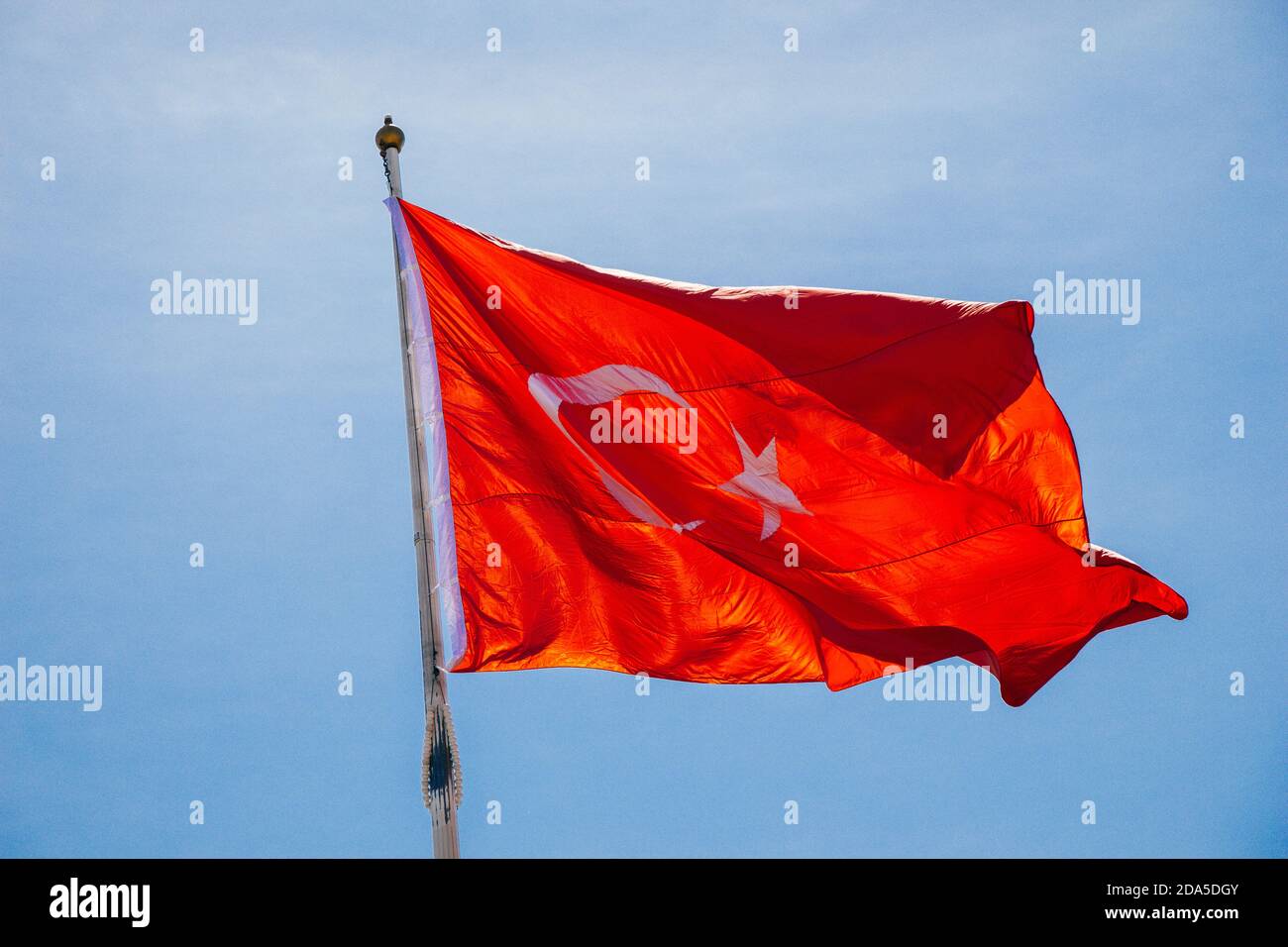 Turkish national flag with white star and moon on a pole in sky Stock ...