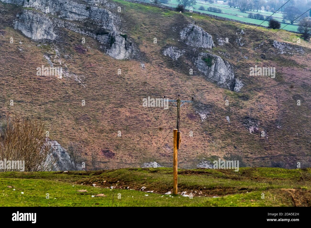 Distance view of prominent outcrops of limestone on the steep flanks of ...
