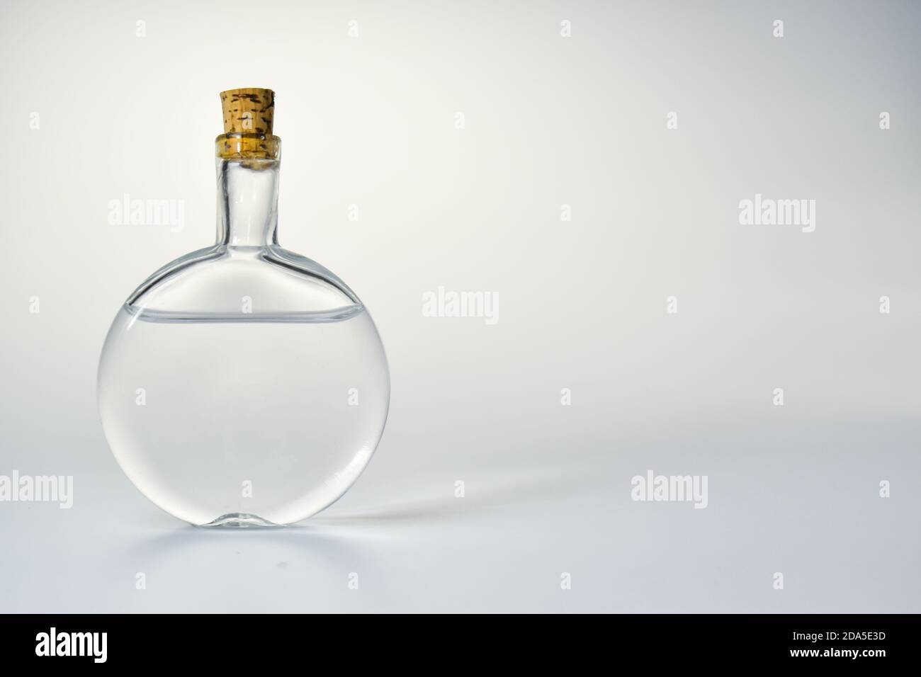 Empty glass bottles on a light background. Vessel for perfumes and ...