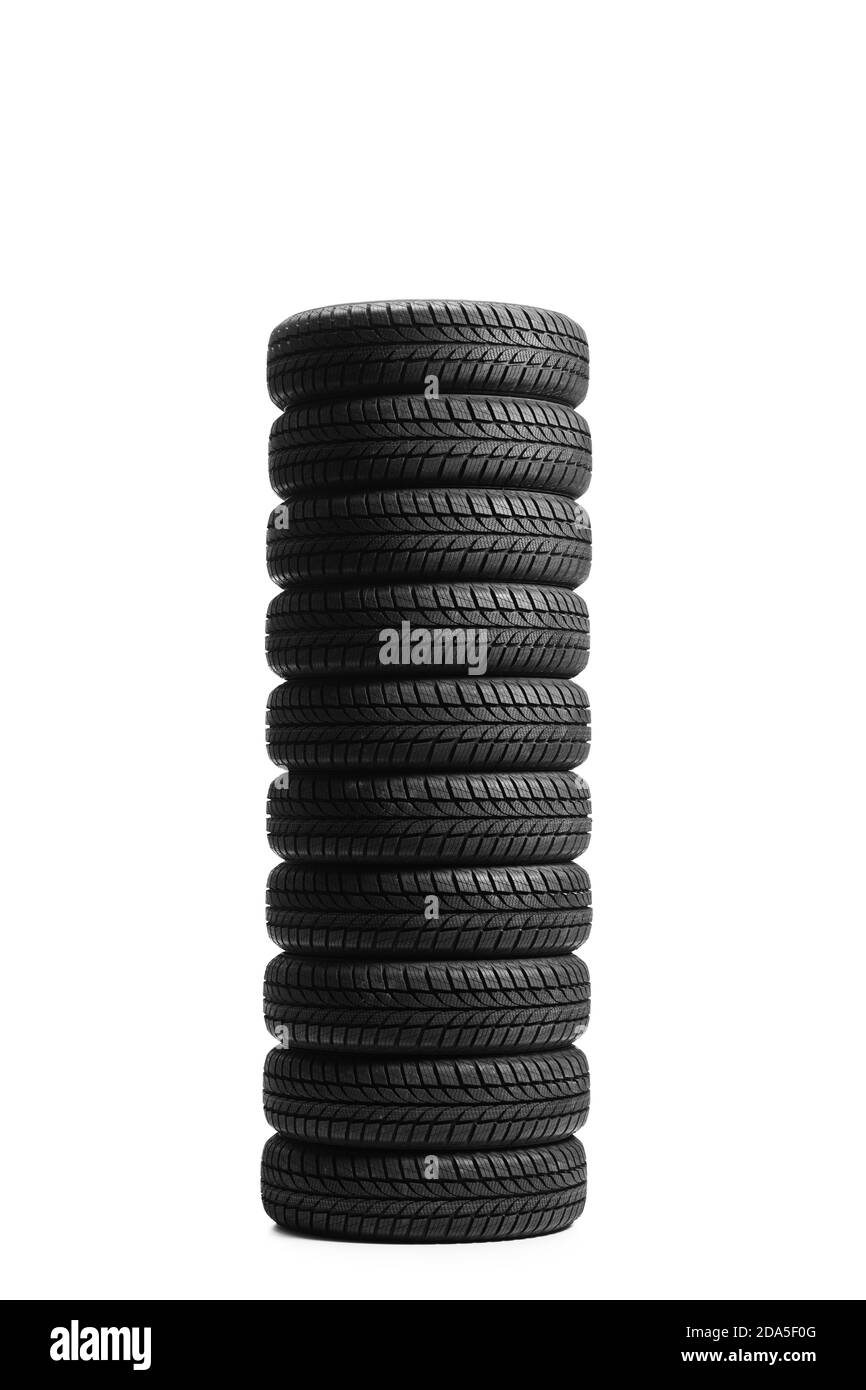 Tall pile of vehicle tires isolated on white background Stock Photo - Alamy
