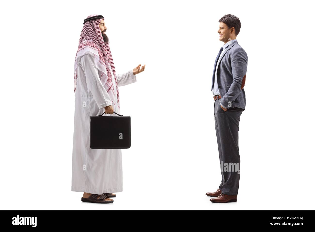 Full length profile shot of an arab talking to a man in a suit isolated ...