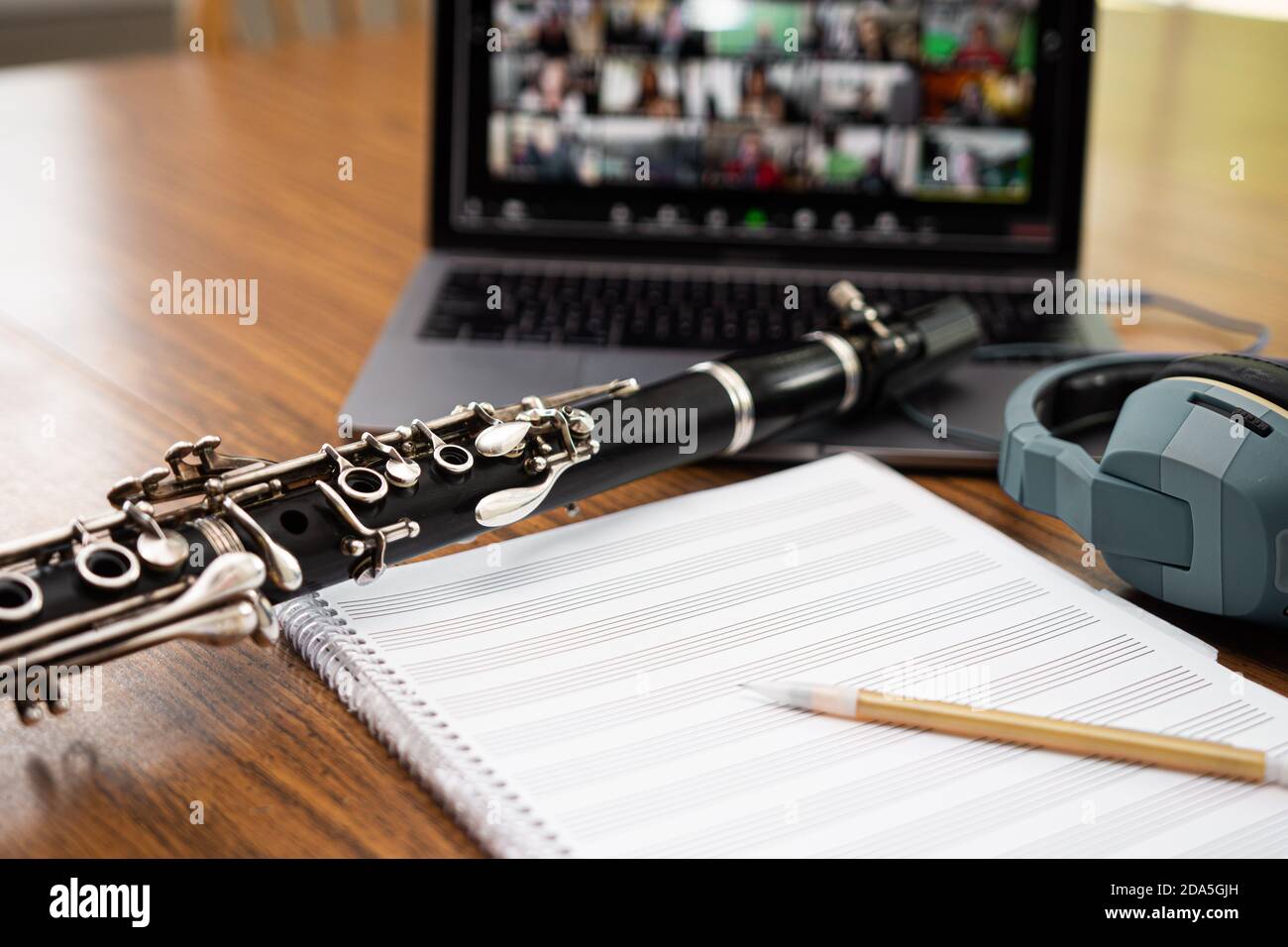 Clarinet, staff paper, and laptop set up for music composition class ...