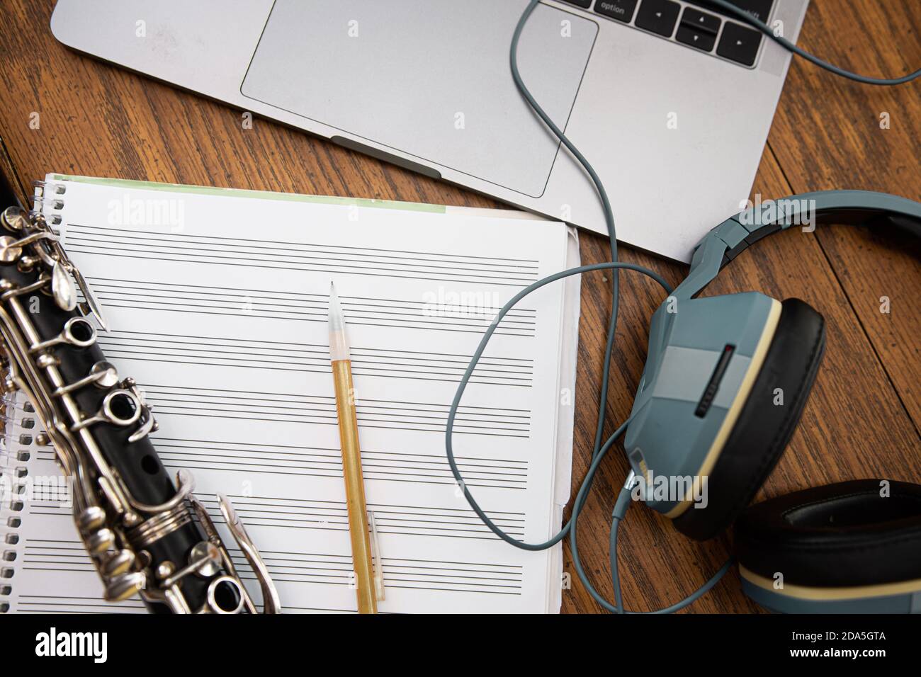 Clarinet, staff paper, and laptop set up for music composition class ...