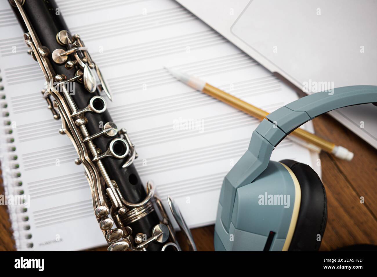 Clarinet, staff paper, and laptop set up for music composition class ...