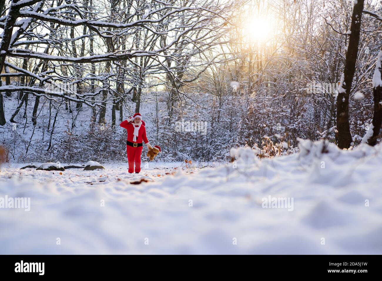 Santa Claus comes in the snow forest, full length Stock Photo - Alamy