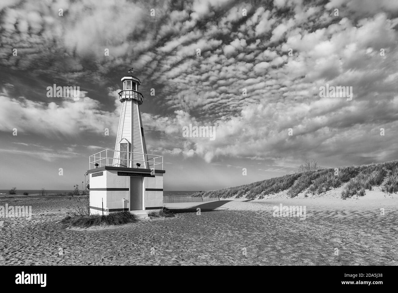 New Buffalo Lighthouse and beach under cloudy sky in New Buffalo ...