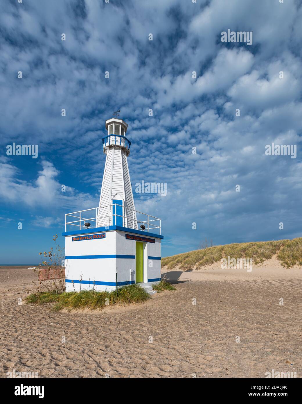 New Buffalo Lighthouse and beach under cloudy sky in New Buffalo ...