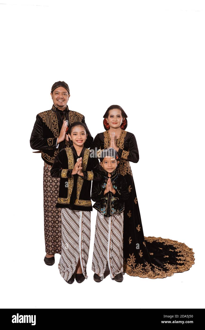 Portrait of a happy family wearing traditional Javanese clothes ...