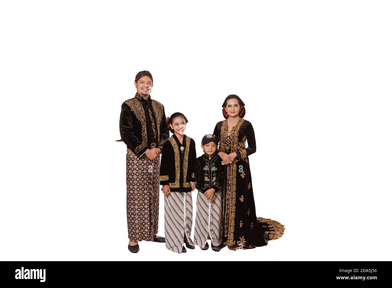Portrait of a happy family wearing traditional Javanese clothes ...