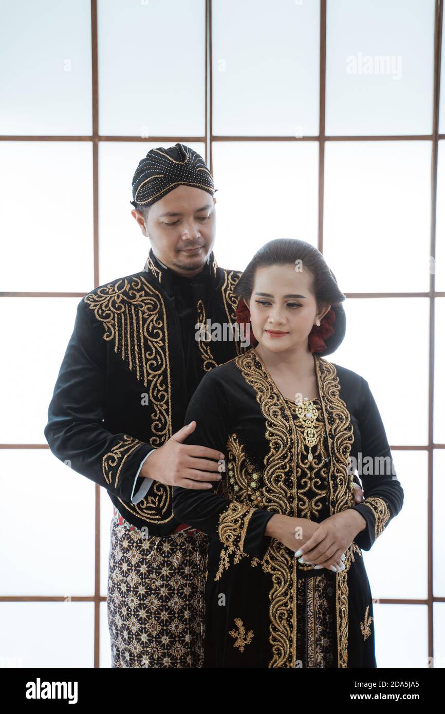 Portrait Happy Men And Women Wearing Javanese Traditional Clothes