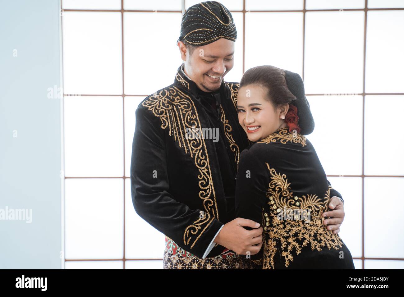 Portrait Happy Men And Women Wearing Javanese Traditional Clothes