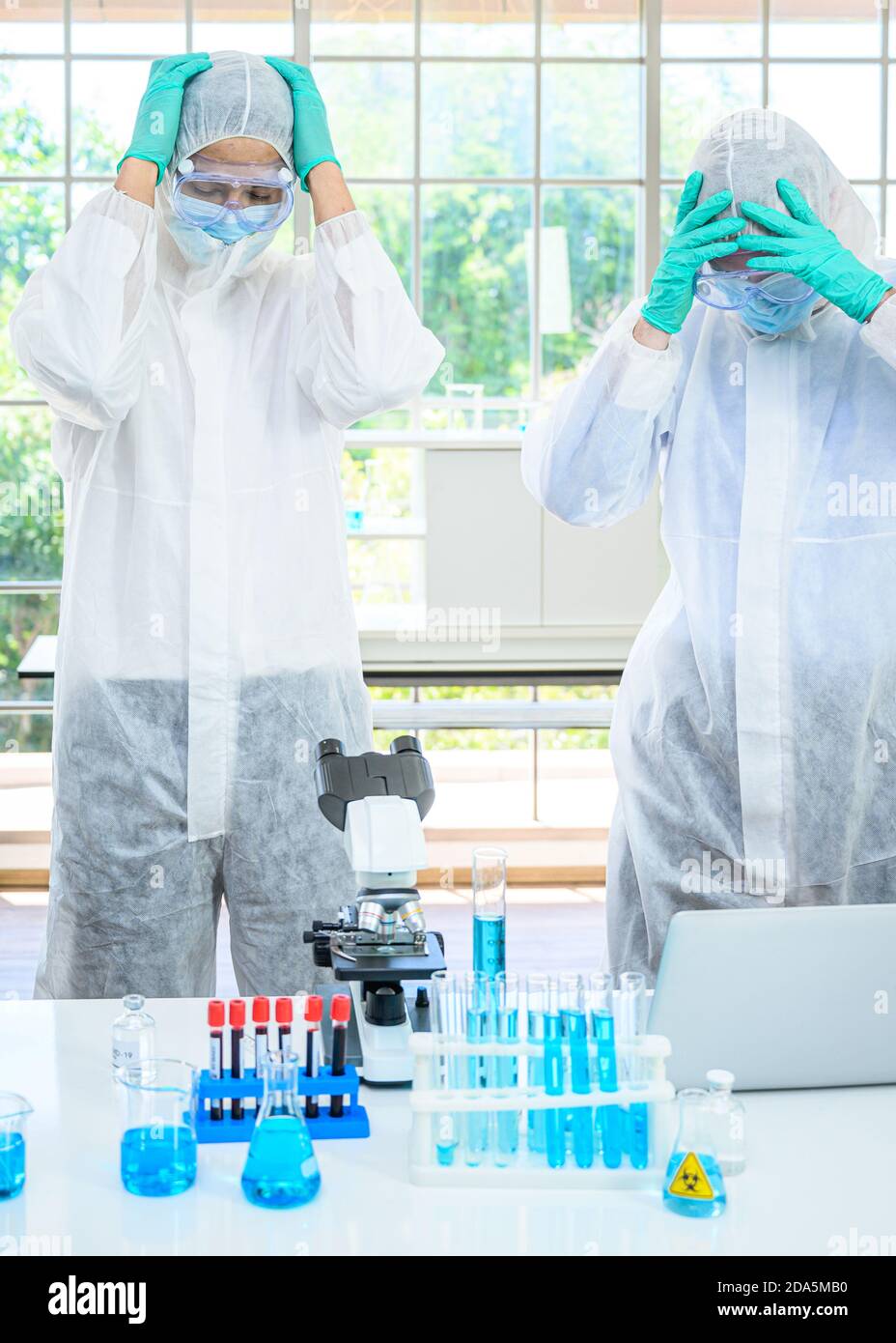 Couple male scientist wearing protection suit serious for unsuccess ...