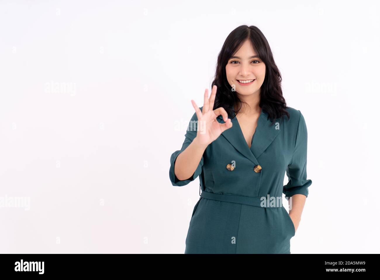 Happy business woman portrait. Showing OK sign Stock Photo - Alamy