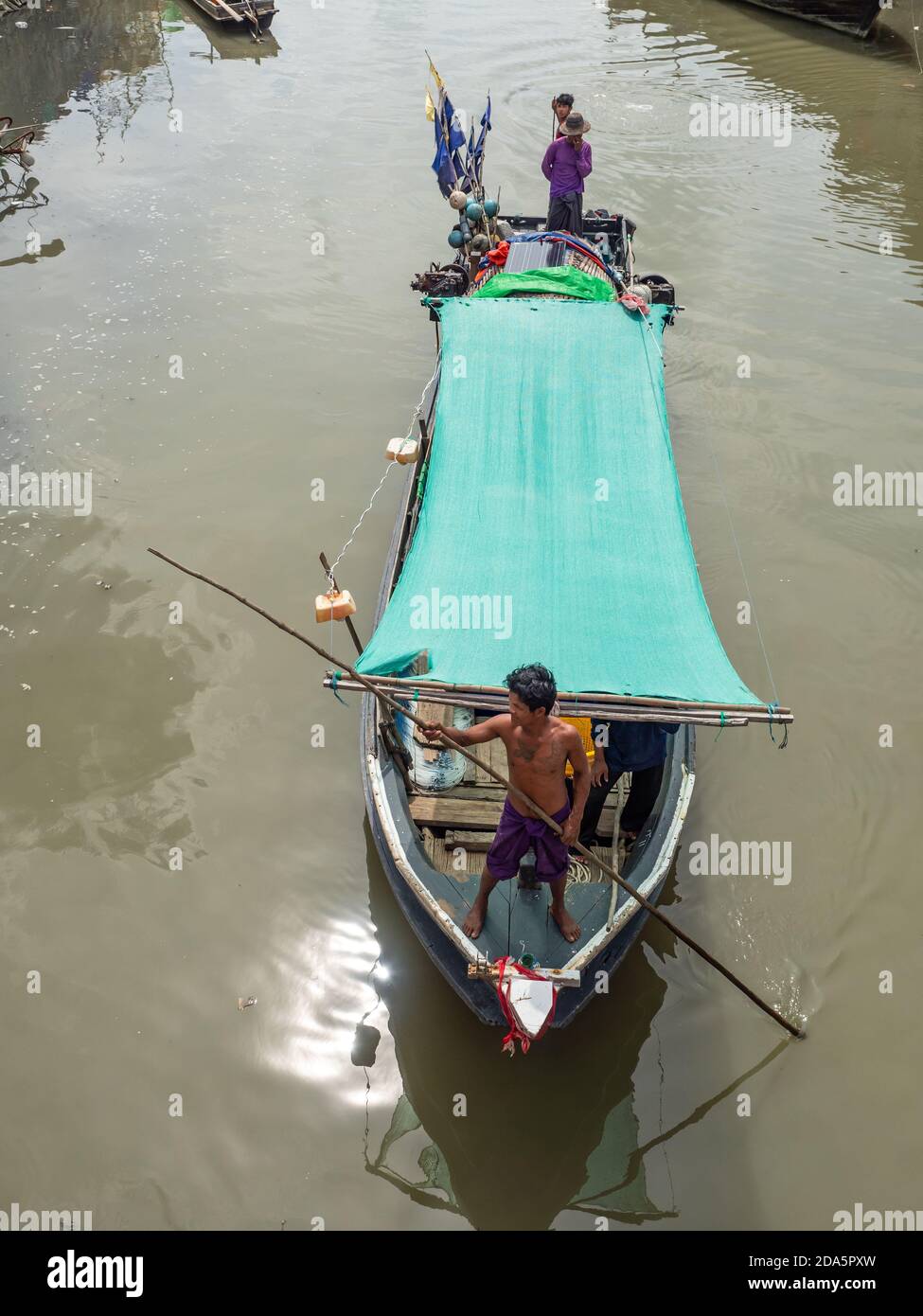 Wooden boats on a canal connected to the Tanintharyi River in Myeik ...