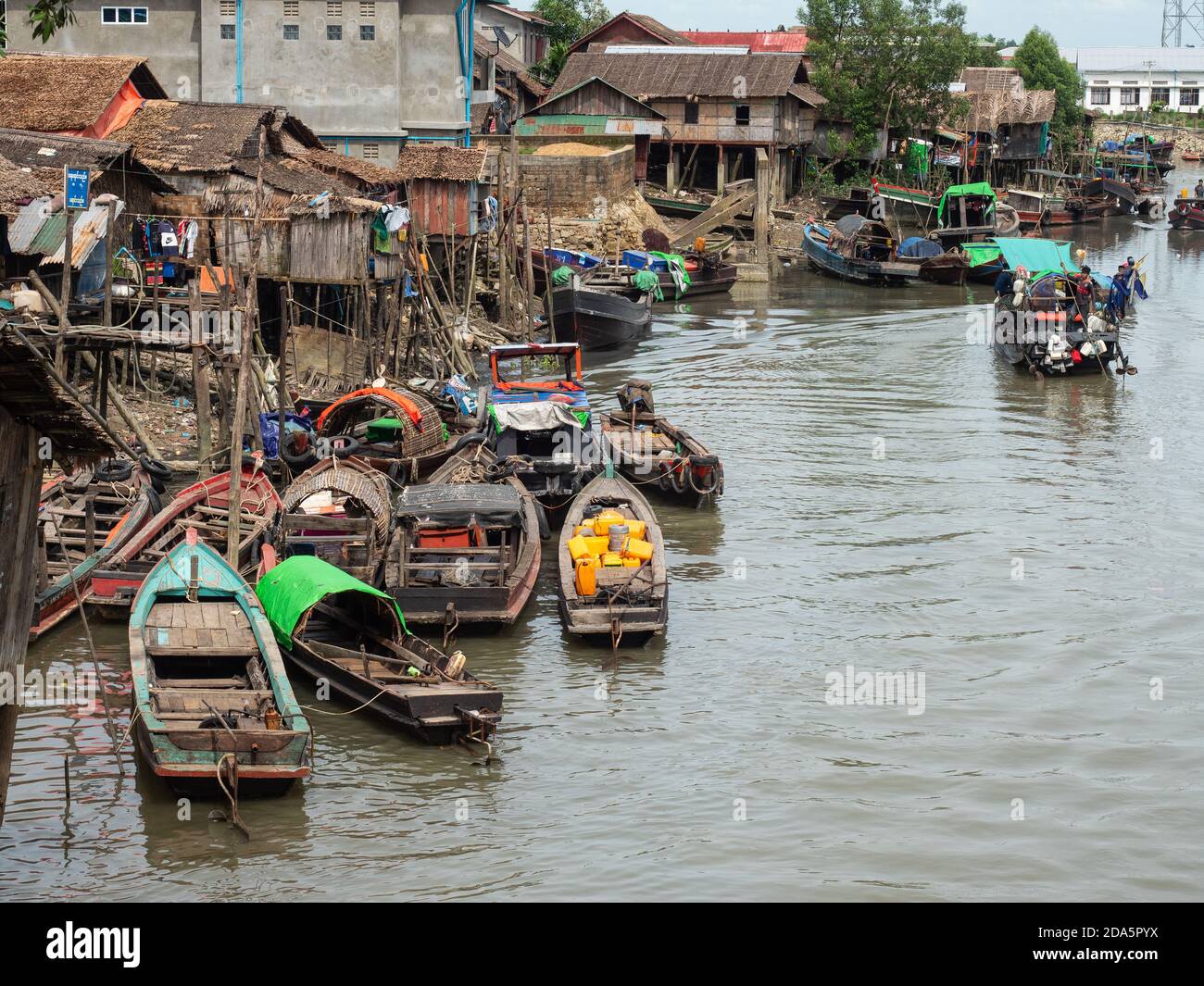 Wooden boats on a canal connected to the Tanintharyi River in Myeik ...