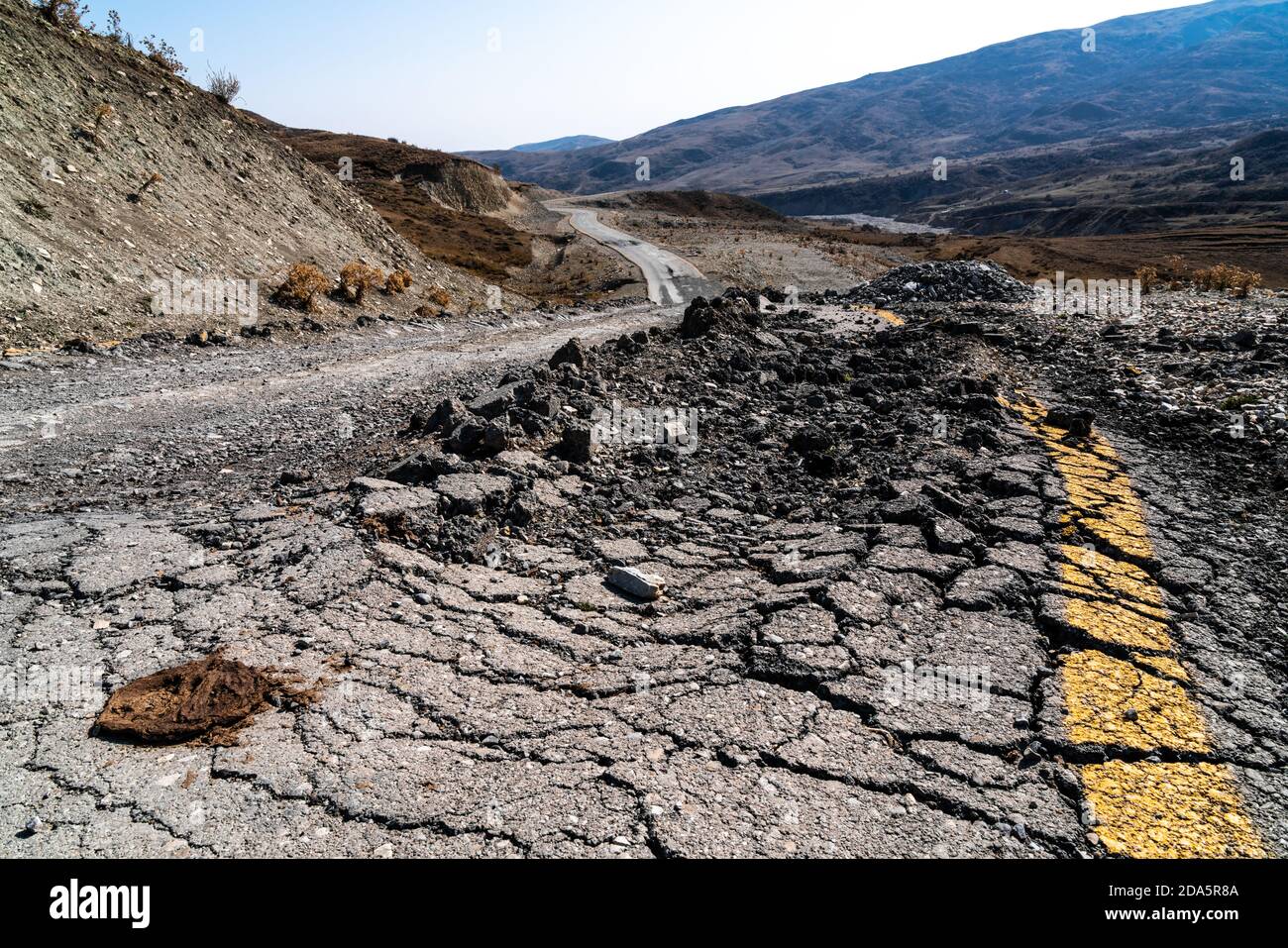 Destroyed asphalt road, earthquake consequences Stock Photo - Alamy