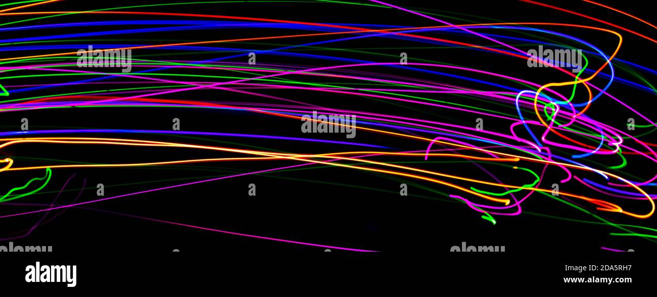Multi color light painting photography, swirl and curve of blue, green ...