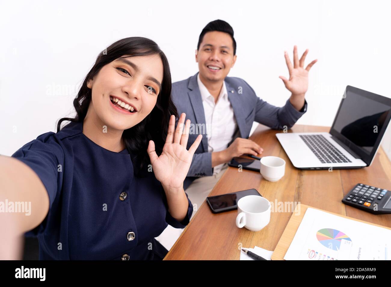 a portrait of a business partner video call at work on modern office ...