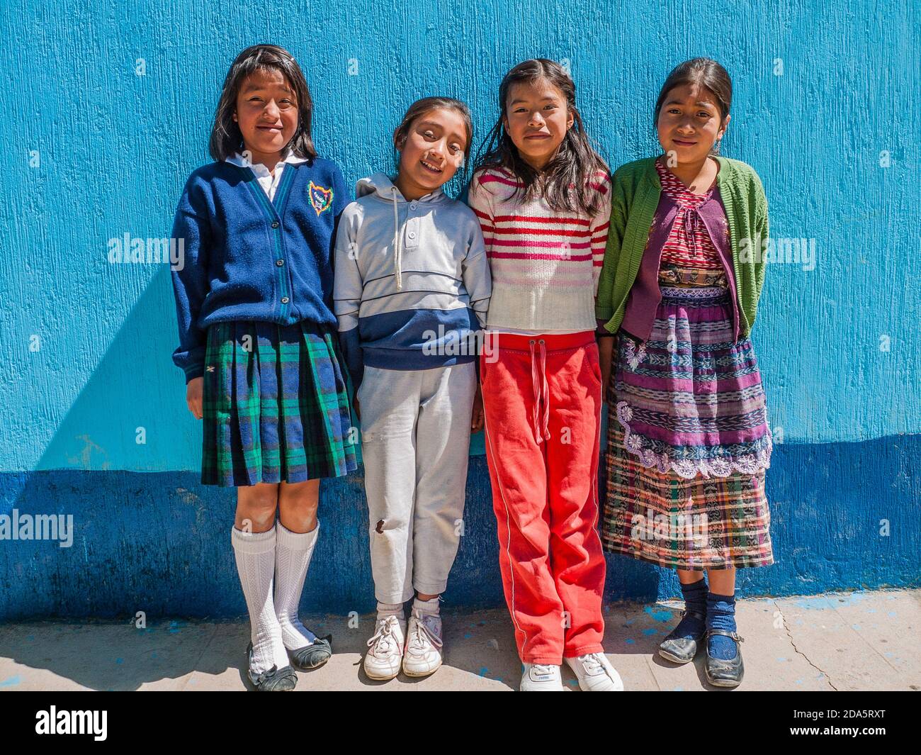 Four female primary school classmates Stock Photo - Alamy