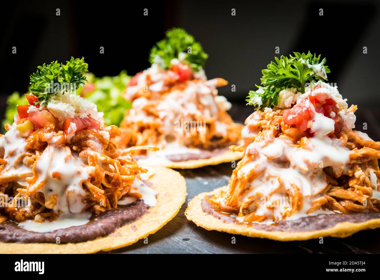 Hard shell Nachos with pulled pork and sauce Stock Photo - Alamy