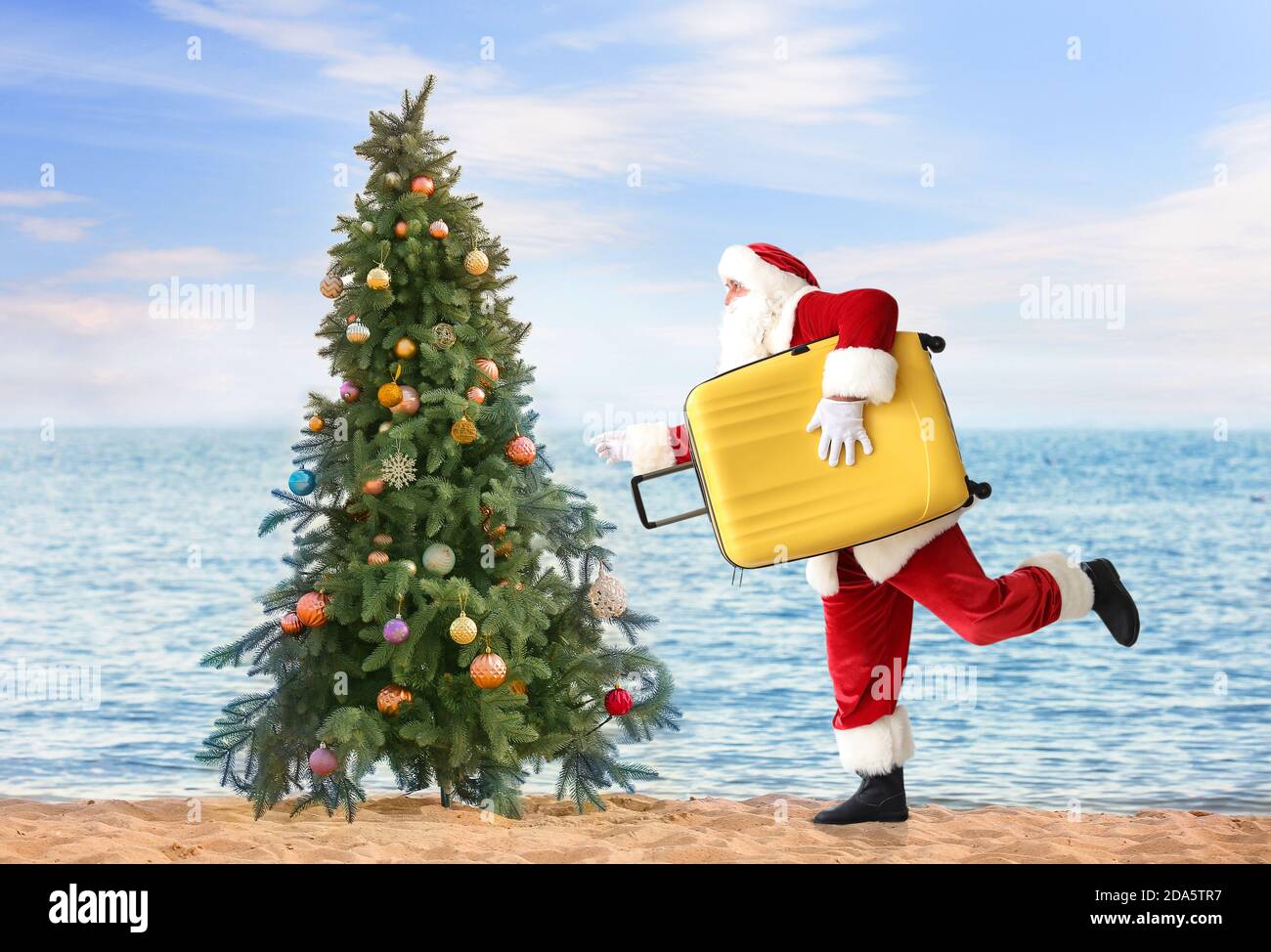 Running Santa Claus with luggage at sea resort on Christmas eve Stock ...