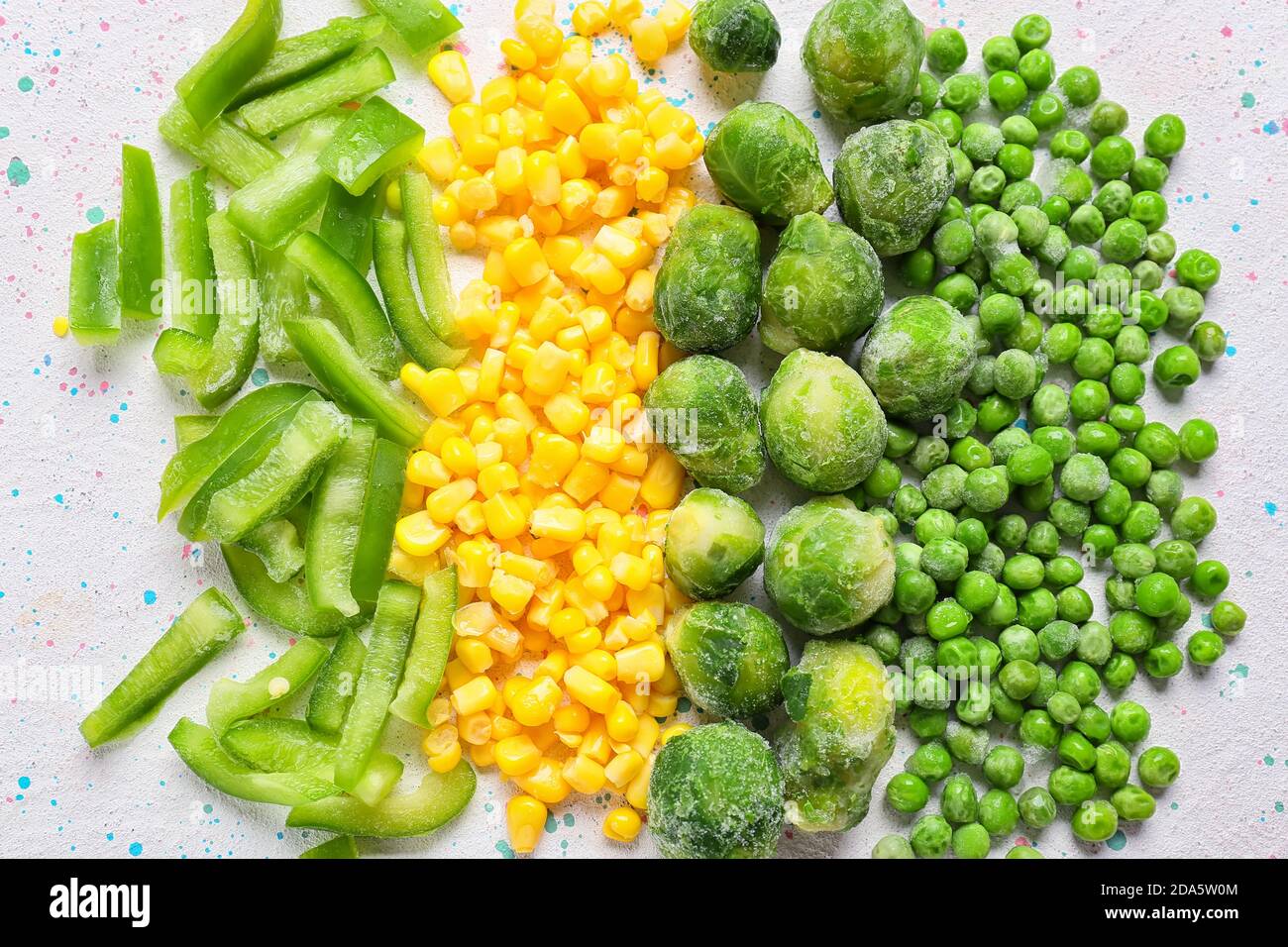 Different frozen vegetables on white background Stock Photo - Alamy