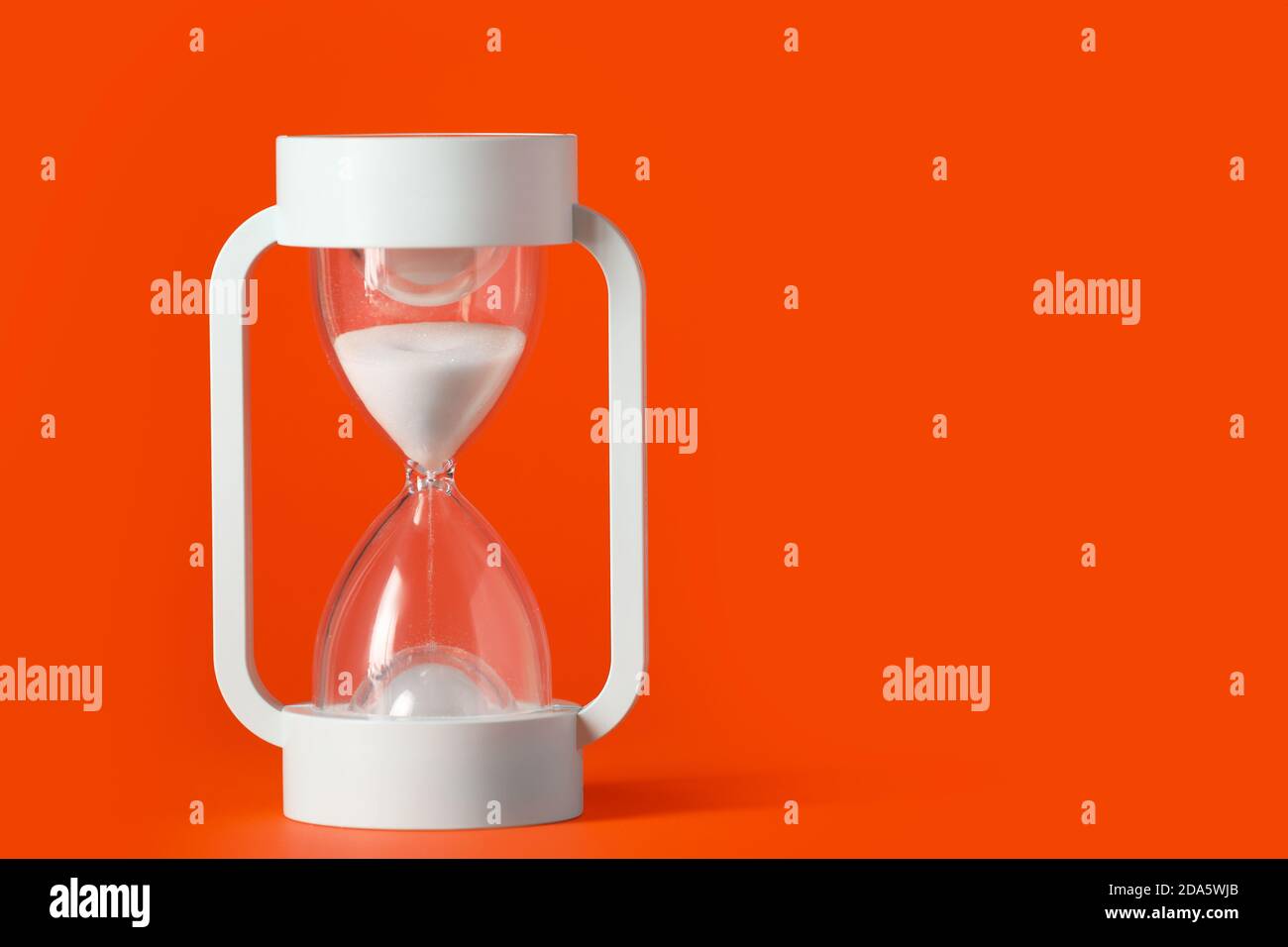 Hourglass on color background. Time management concept Stock Photo - Alamy