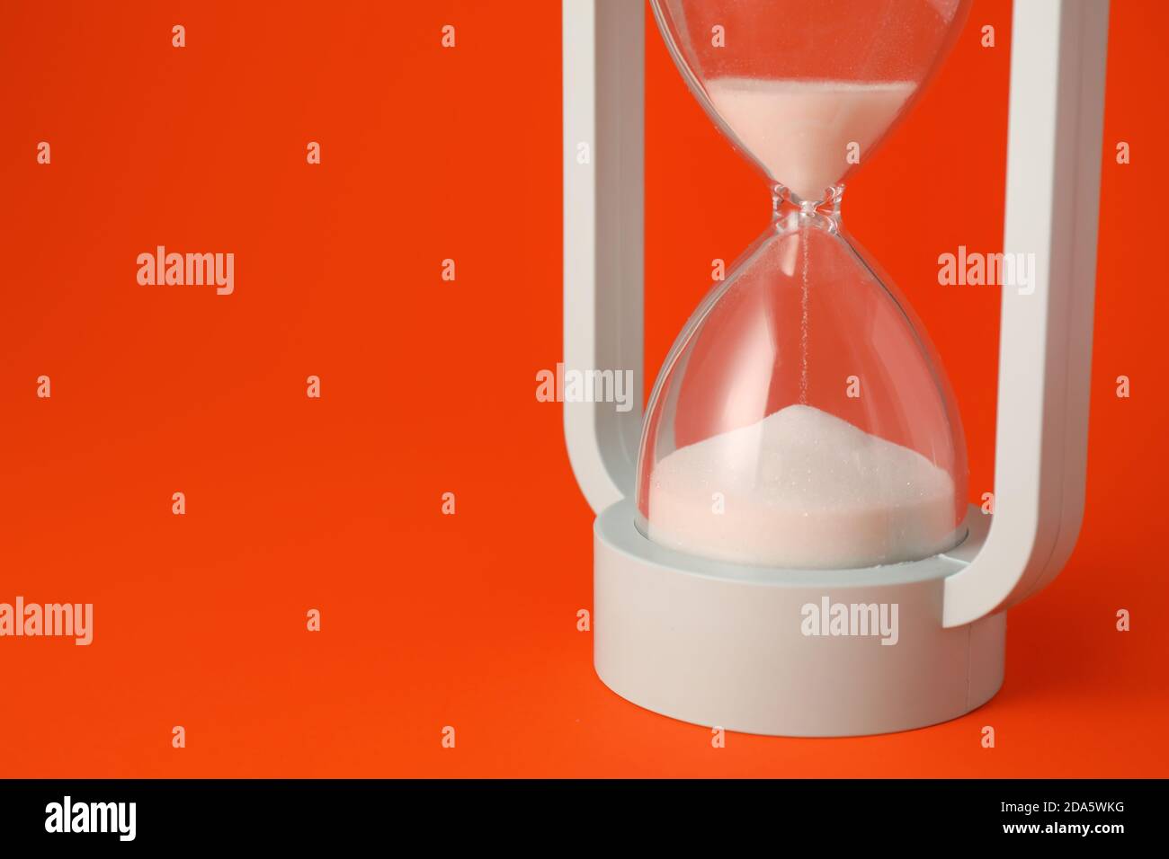 Hourglass on color background. Time management concept Stock Photo - Alamy
