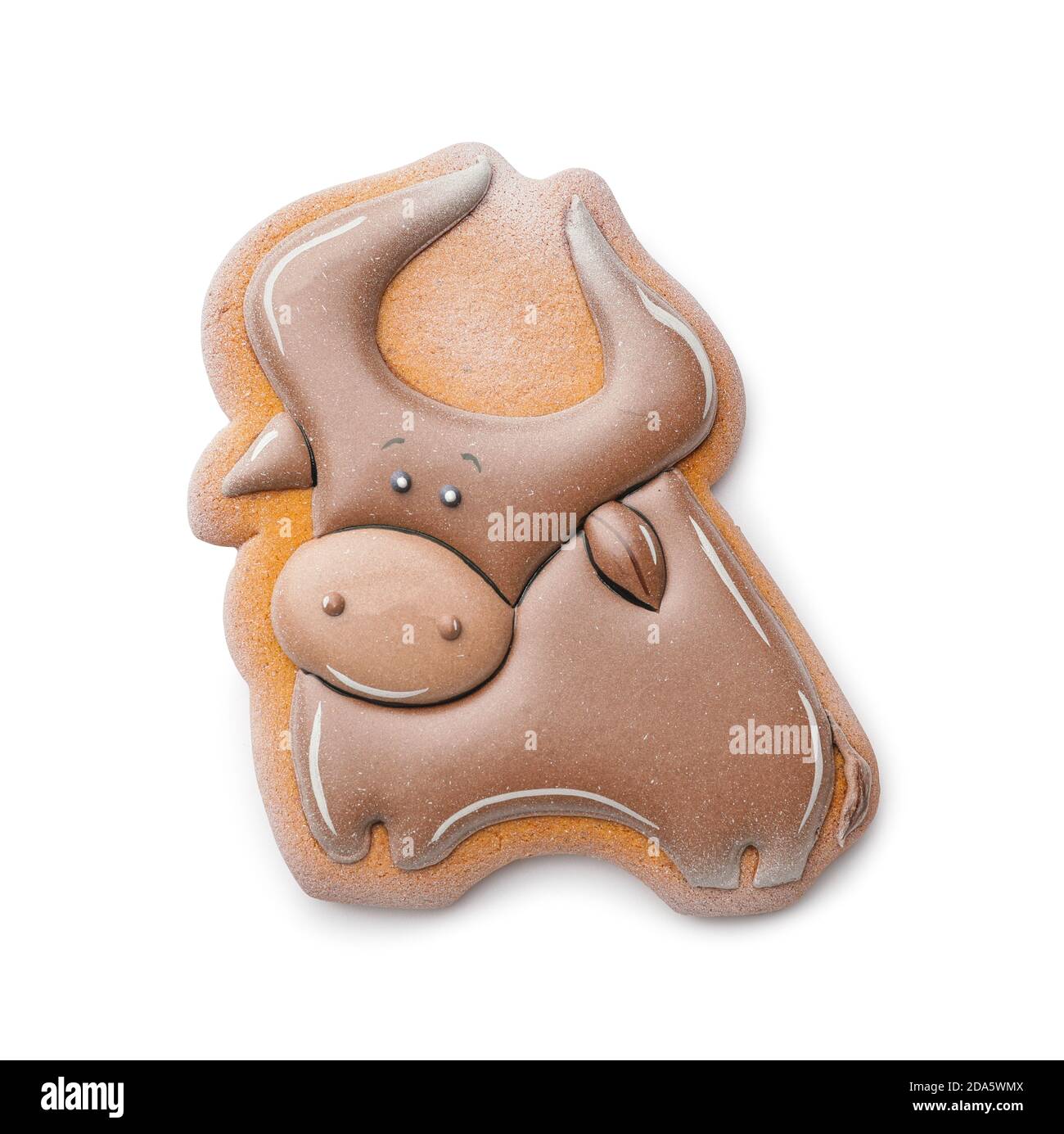 Tasty Christmas cookie in shape of bull on white background Stock Photo ...
