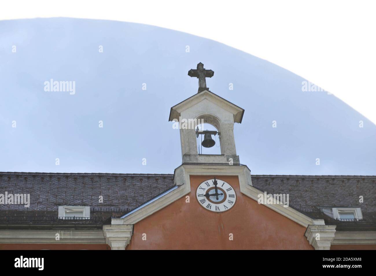 church bell in a christian building with clock and cross Stock Photo ...