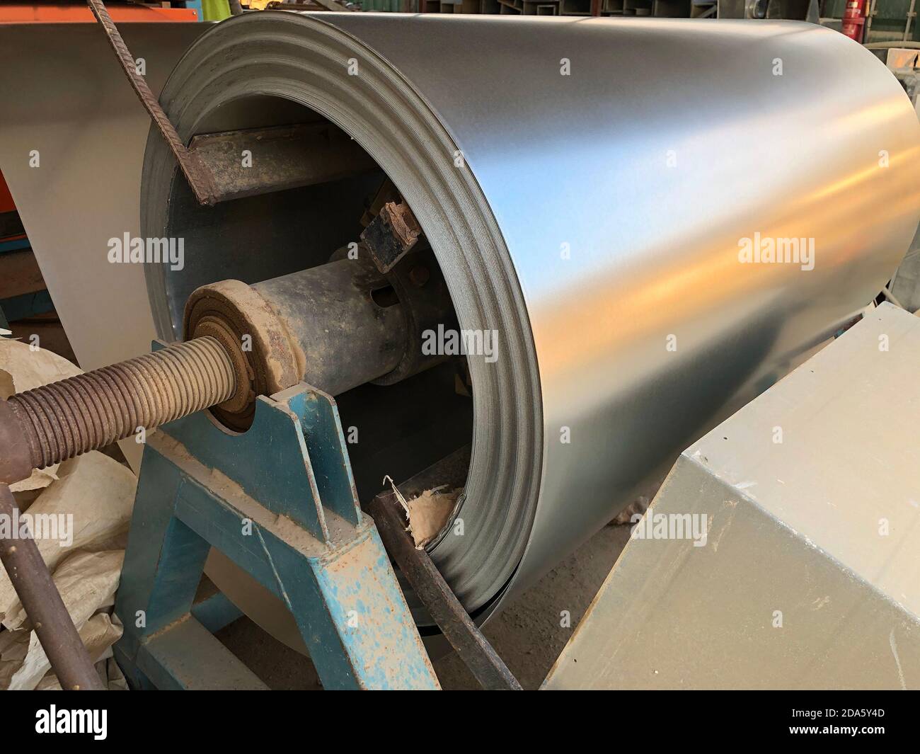 Rolled halvanized metal at construction site workshop. Tinsmith metal ...