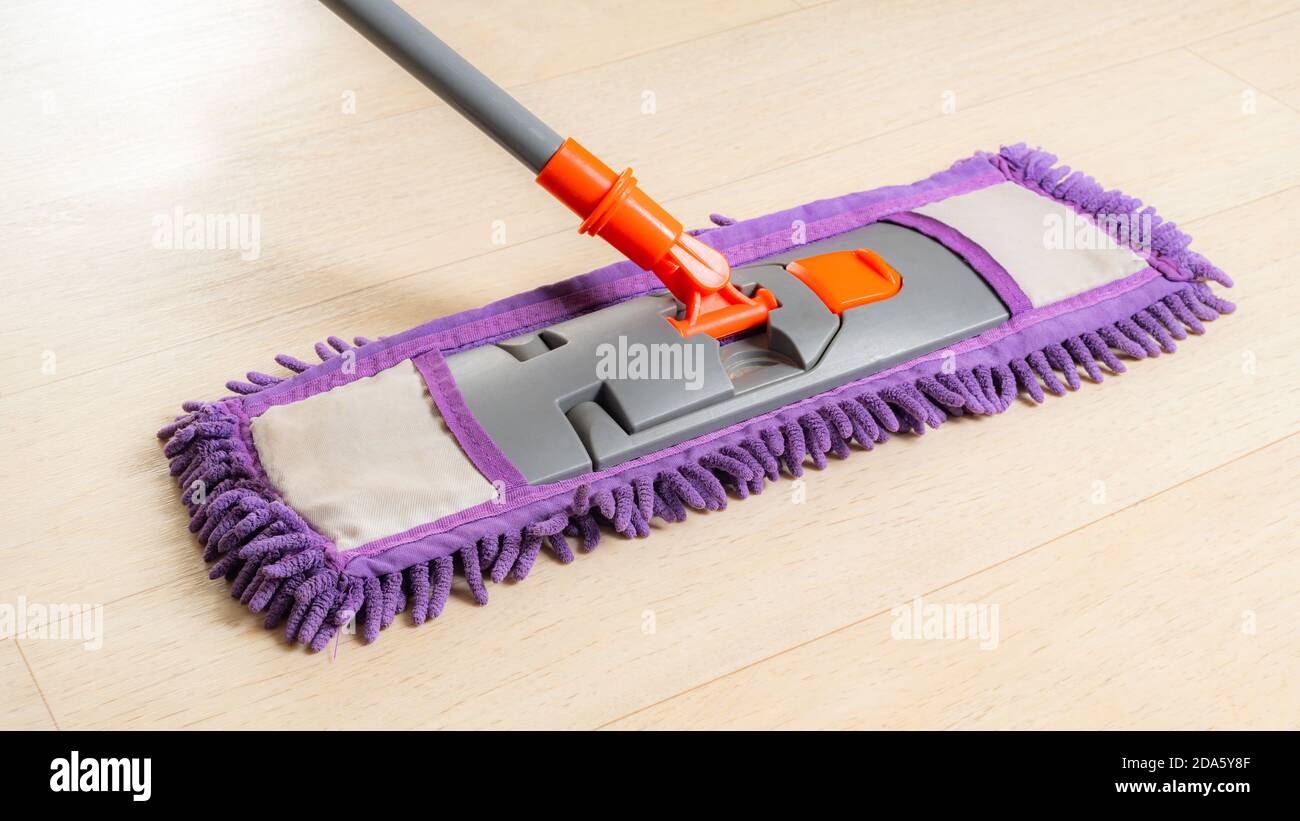 mop with a rag close-up on light linoleum Stock Photo - Alamy
