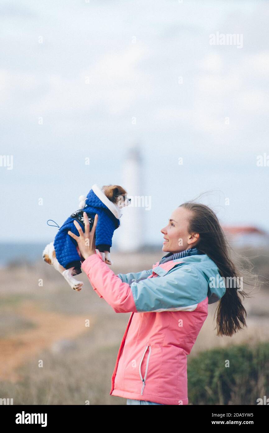 Woman raising dog hi-res stock photography and images - Alamy