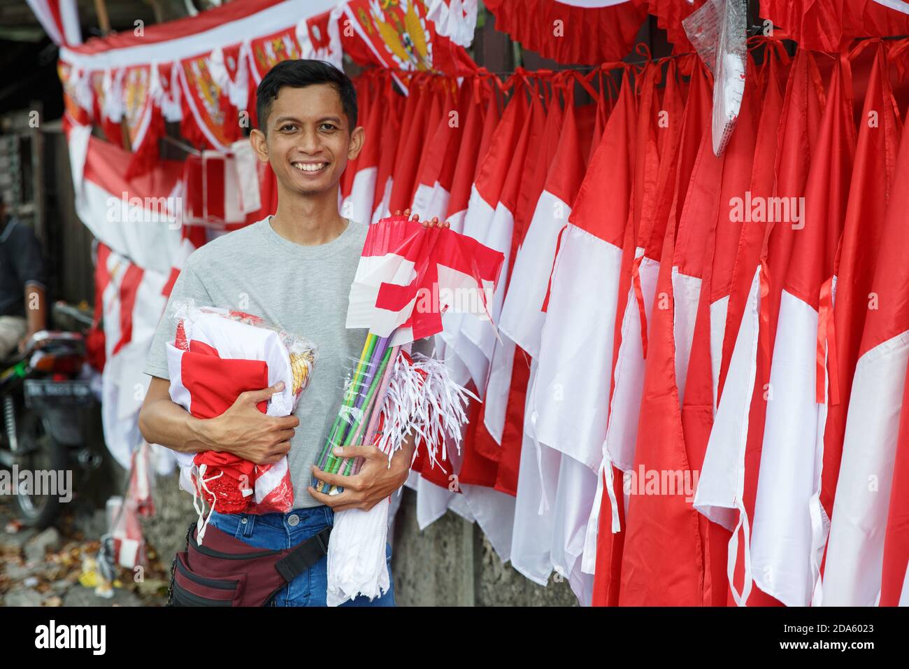 portrait of a young man selling the Indonesian national flag Stock ...
