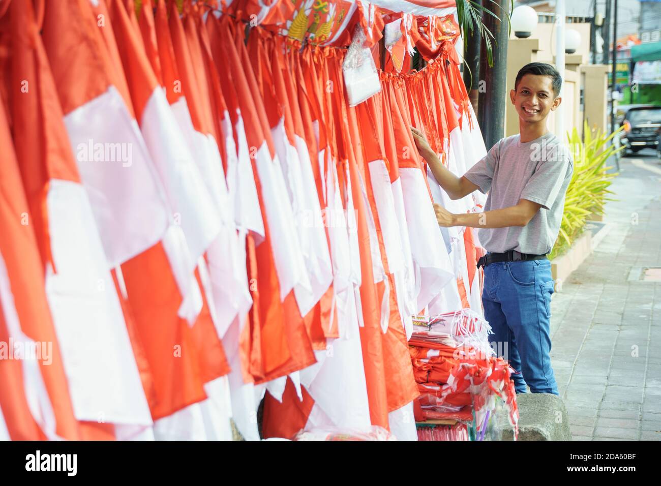 portrait of a young man selling the Indonesian national flag Stock ...