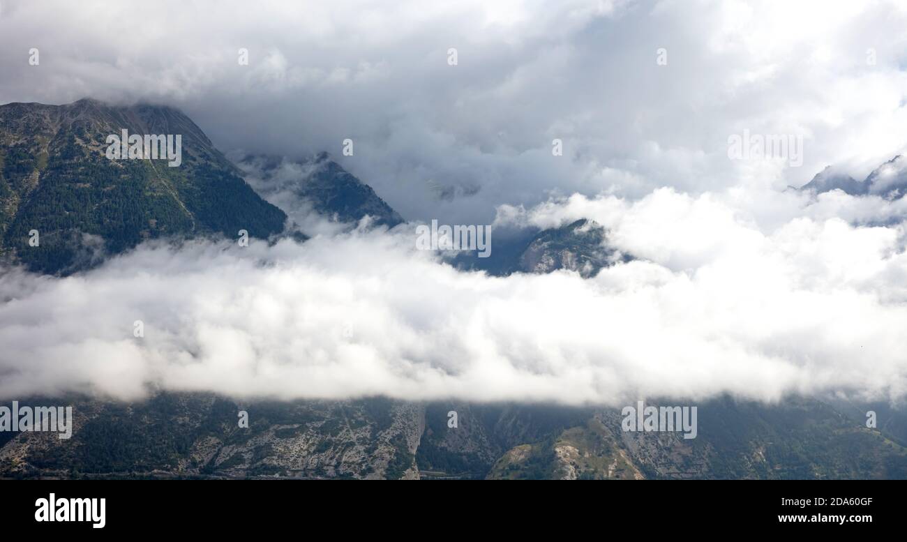 Moving clouds over mountains hi-res stock photography and images - Alamy