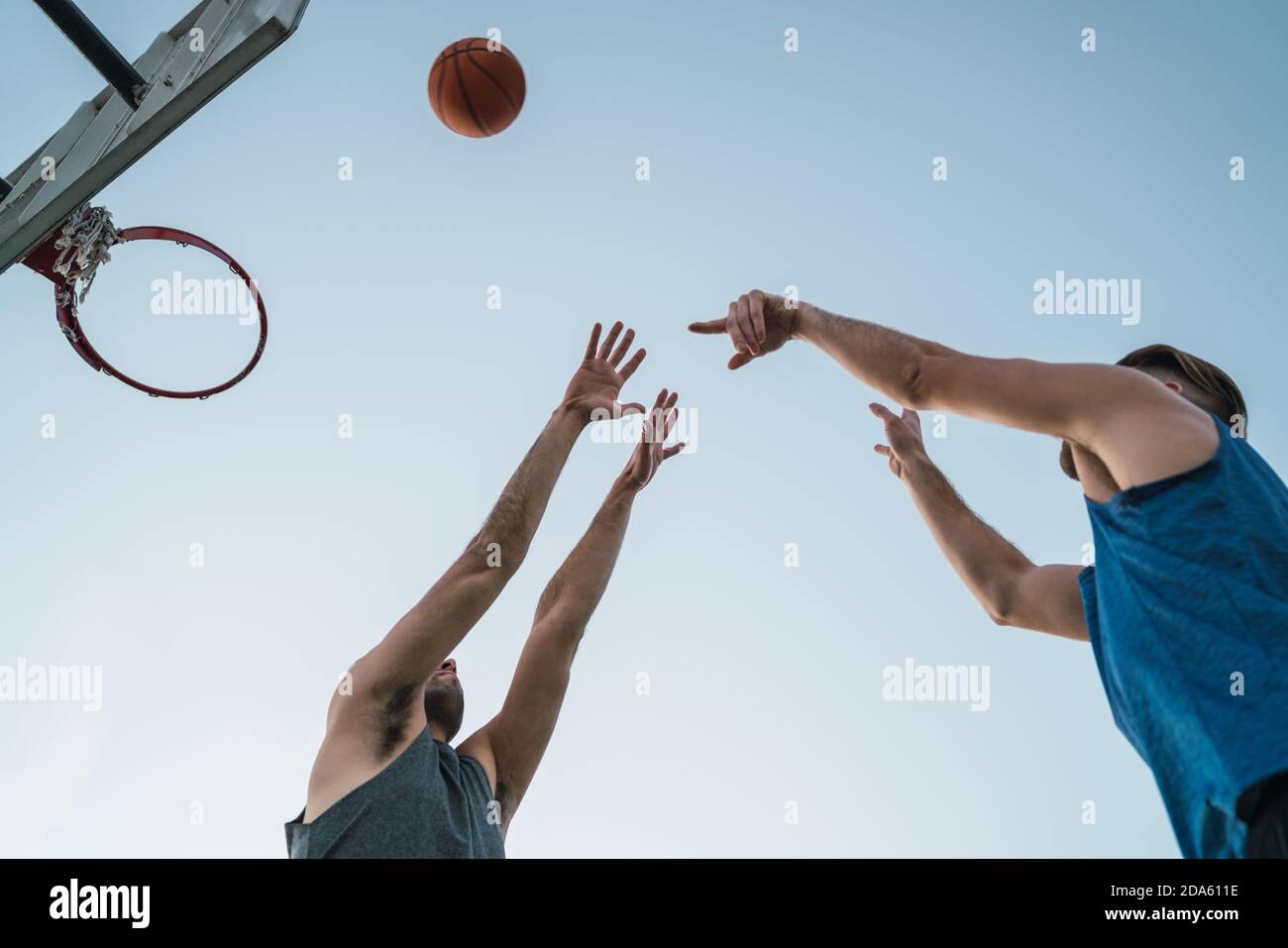 Young basketball players playing one-on-one Stock Photo - Alamy