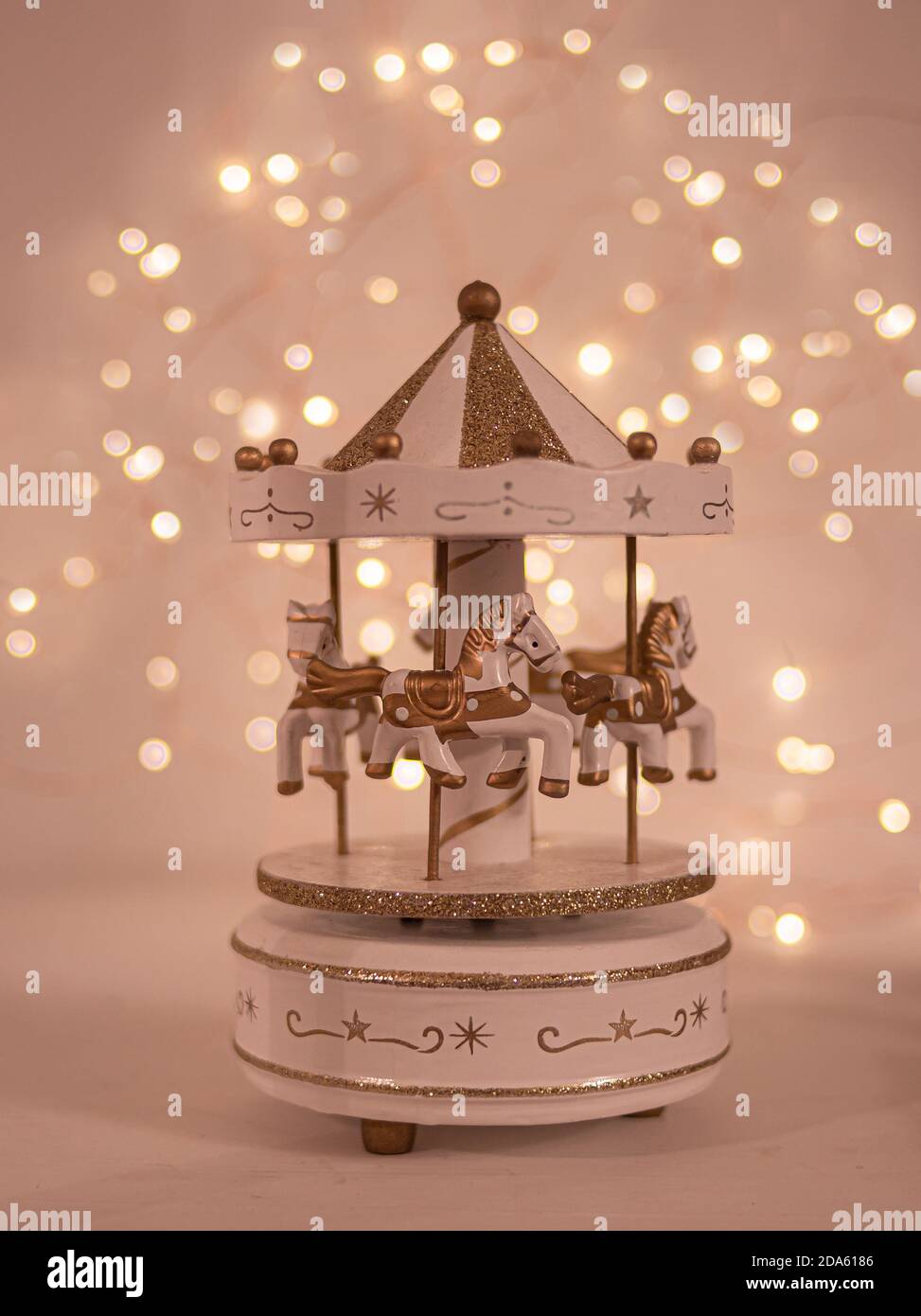 christmas festive scenery showing a musical box with golden carousel ...