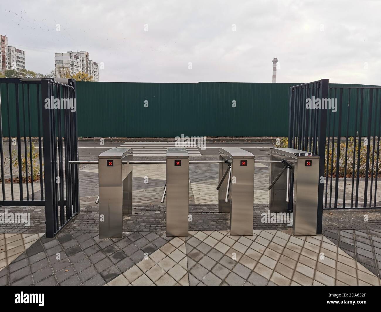Closed entrance turnstile with access denied red sign. Security barrier ...