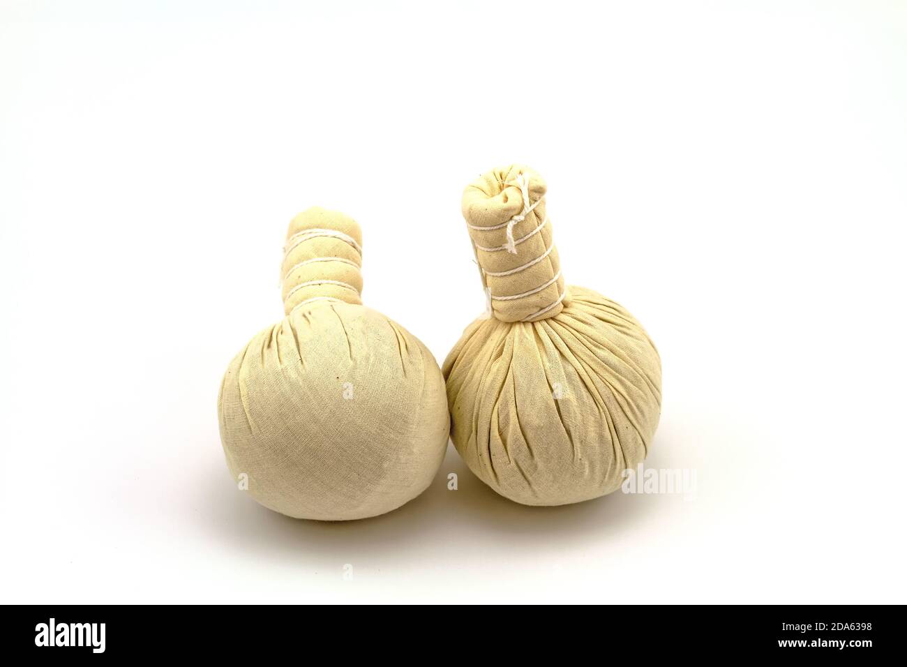 Spa herbal compressing ball on white background Stock Photo - Alamy