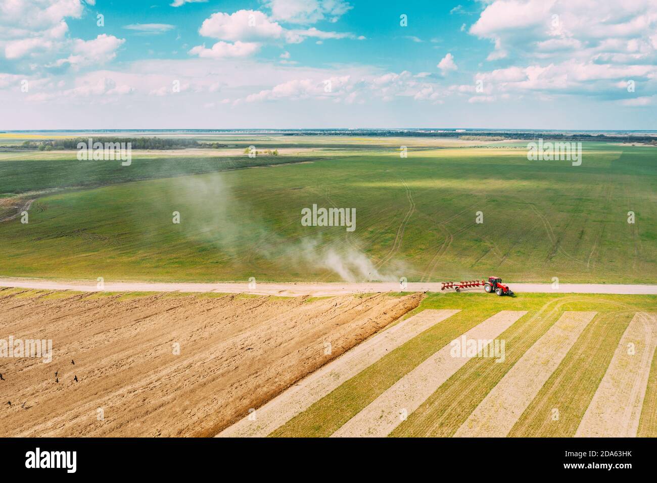 Aerial View. Tractor Plowing Field In Spring Season. Beginning Of ...