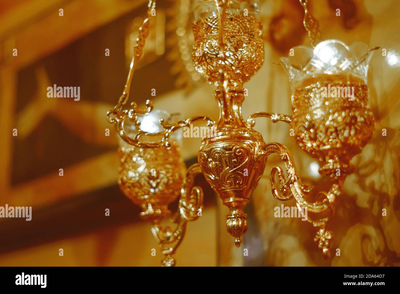 Golden lamps in the Church, religion Stock Photo - Alamy