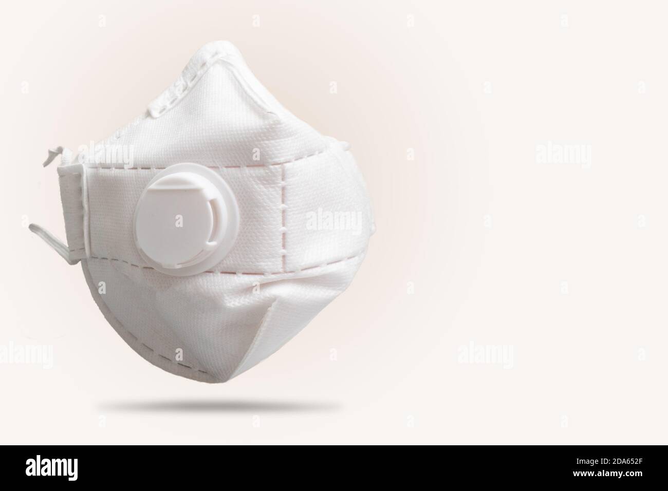 White n95 mask on gray background, n95 respirator with ventilation ...